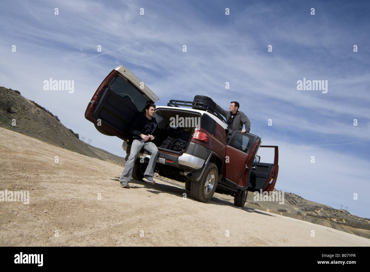 Two men ready to off-road in desert Stock Photo - Alamy