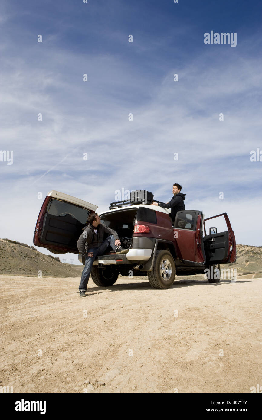 Two men ready to off-road in desert Stock Photo - Alamy