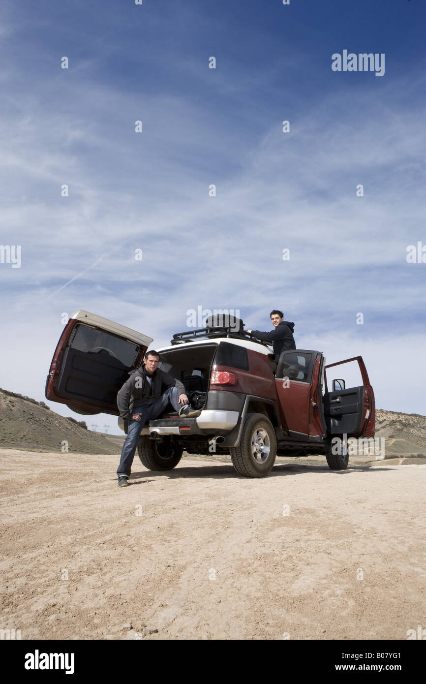 Two men ready to off-road in desert Stock Photo - Alamy