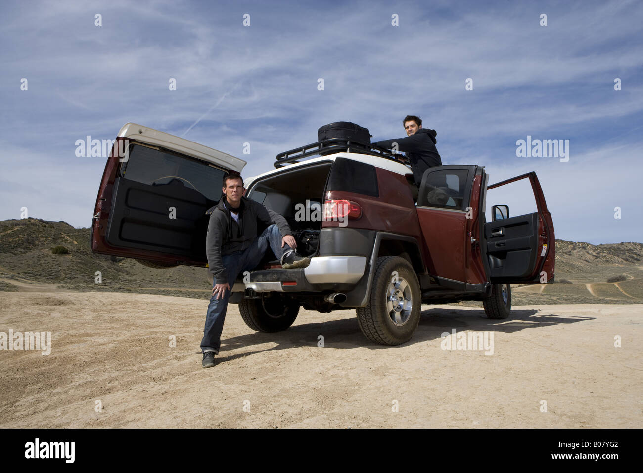 Two men ready to off-road in desert Stock Photo - Alamy