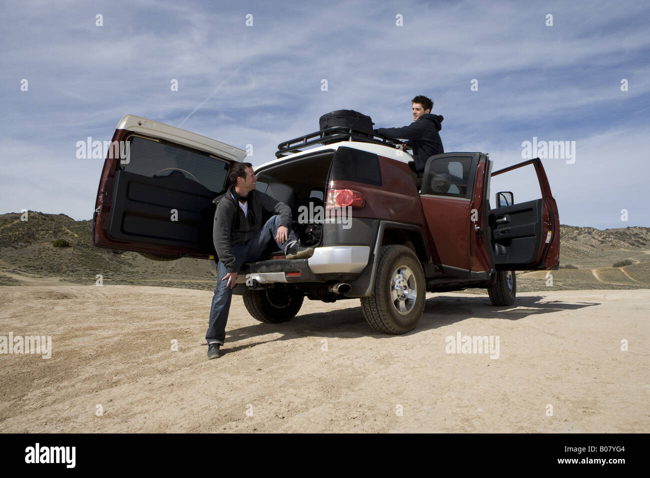 Two men ready to off-road in desert Stock Photo - Alamy