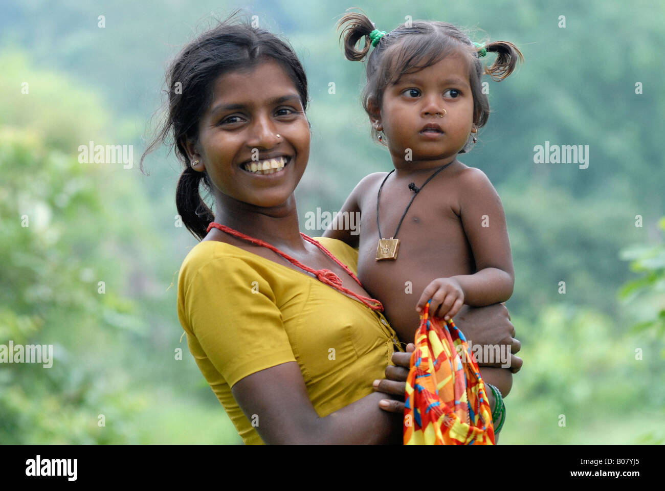 Mother holding her daughter. Warli tribe, Thane, Maharashtra, India ...