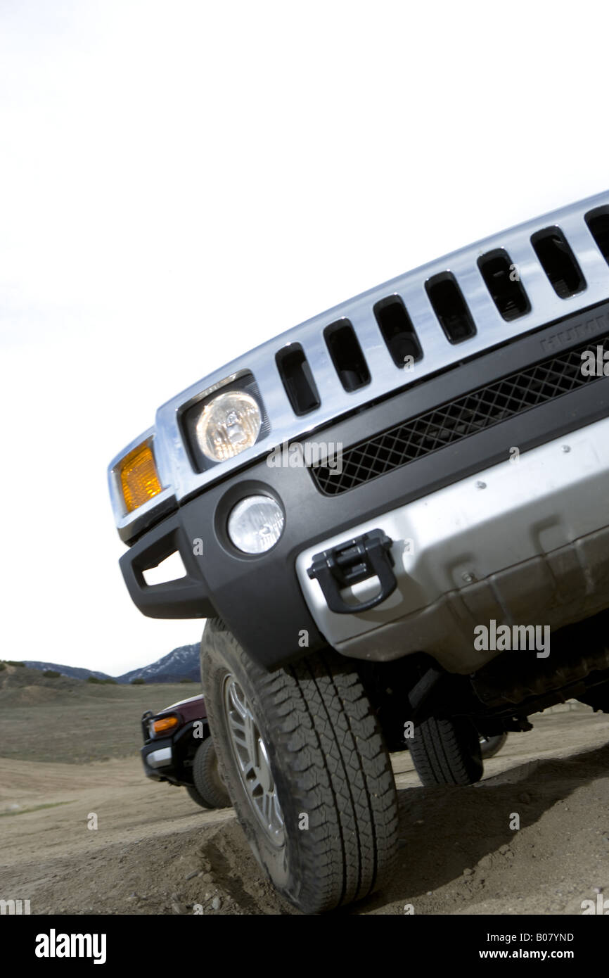 Low front profile of Hummer H3 on rocks Stock Photo - Alamy