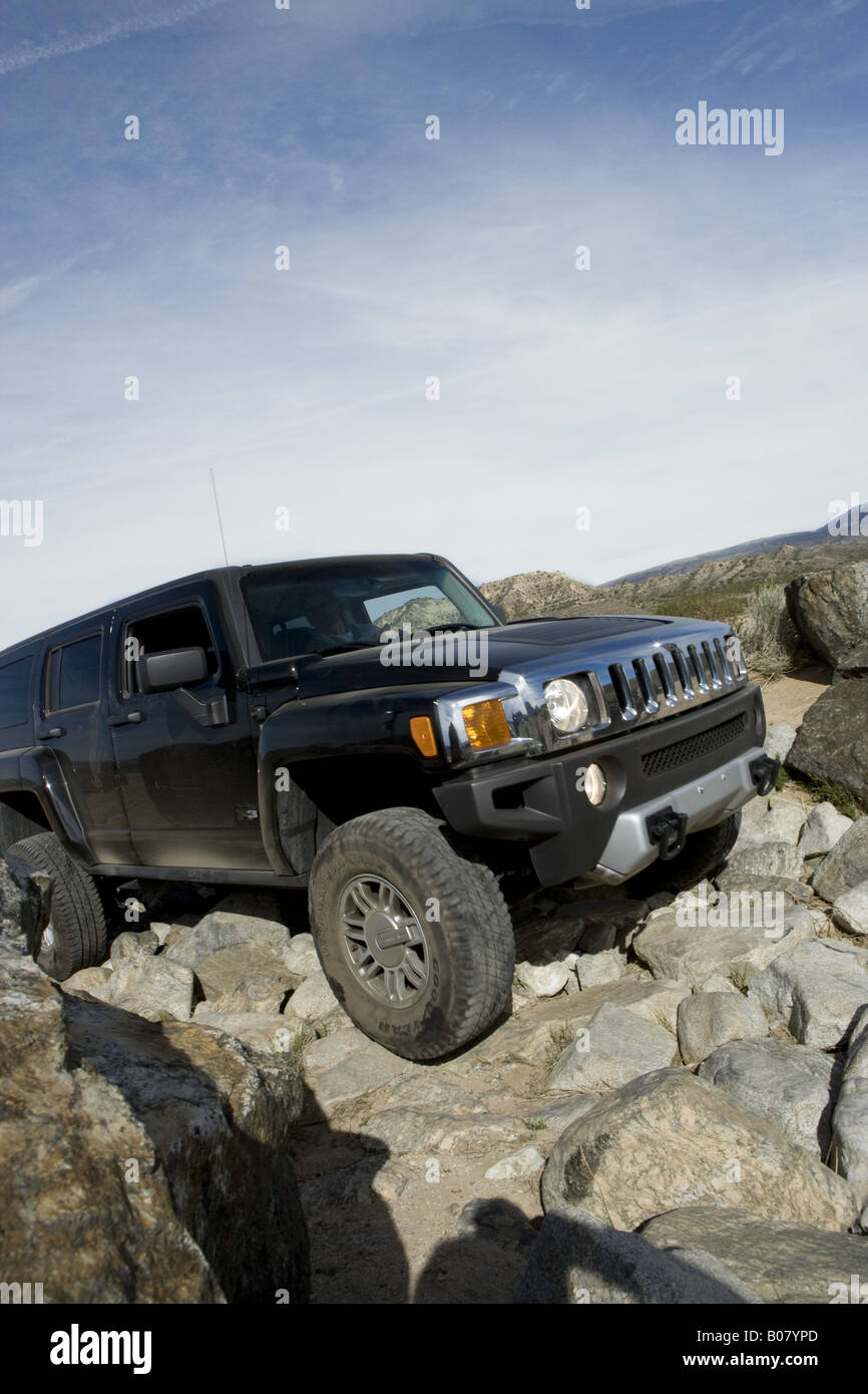 Hummer H3 climbs rocks off-road Stock Photo - Alamy