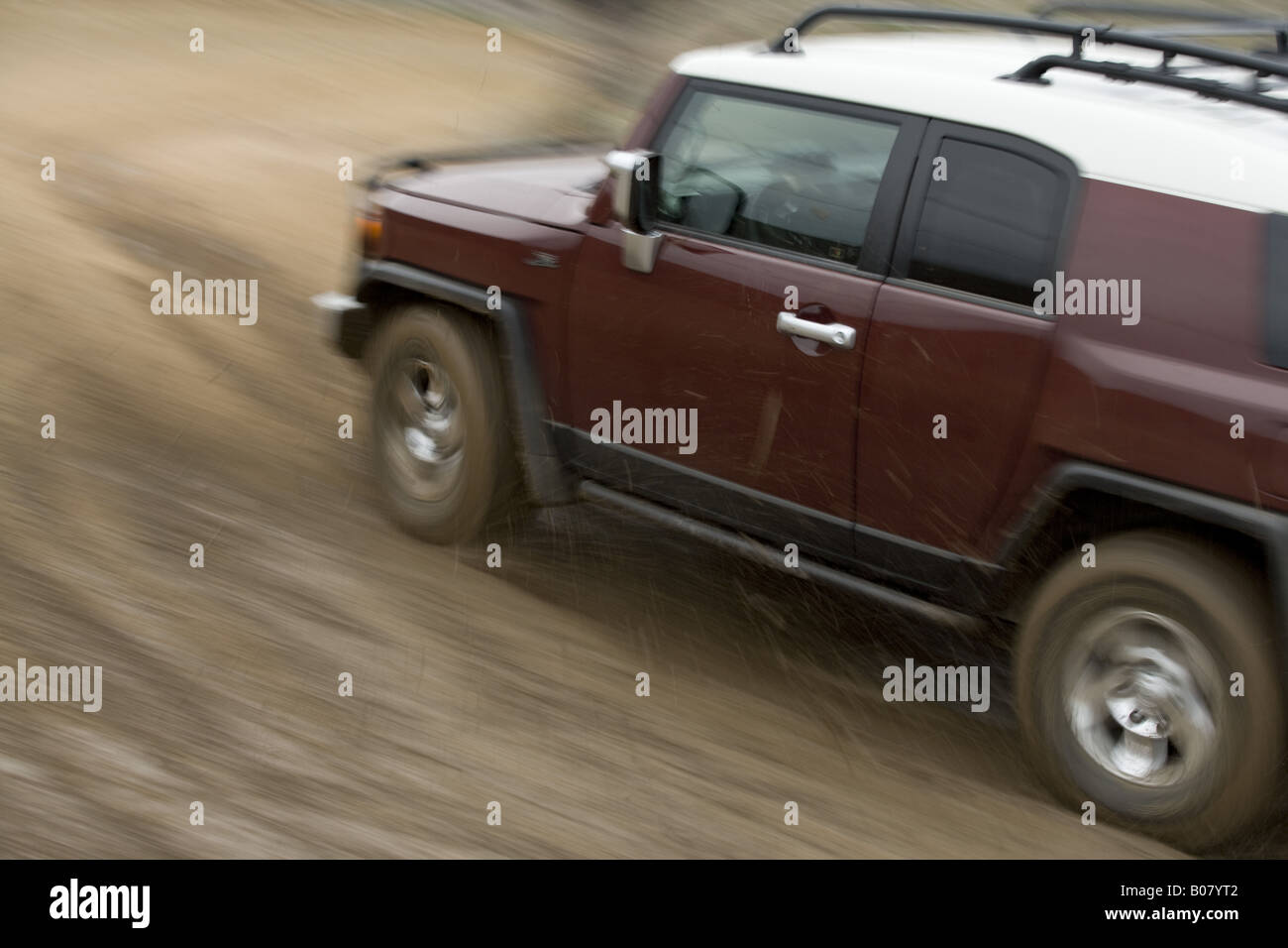Toyota FJ Cruiser runs through mud trail Stock Photo - Alamy