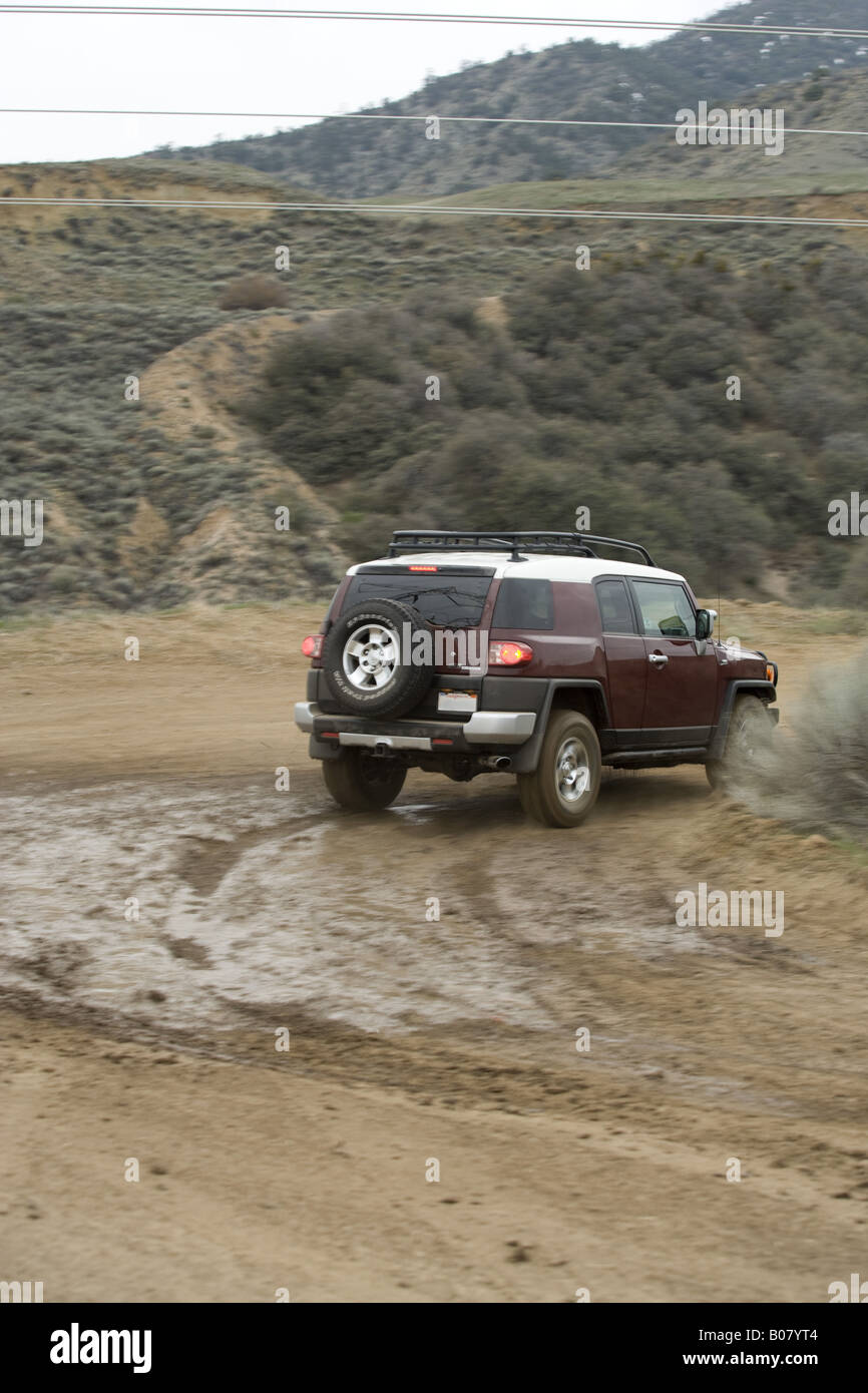 Toyota FJ Cruiser runs through mud trail Stock Photo - Alamy