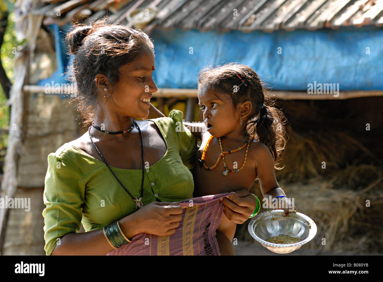 Mother with her daughter in her arms. Warli tribe, Thane, Maharashtra ...