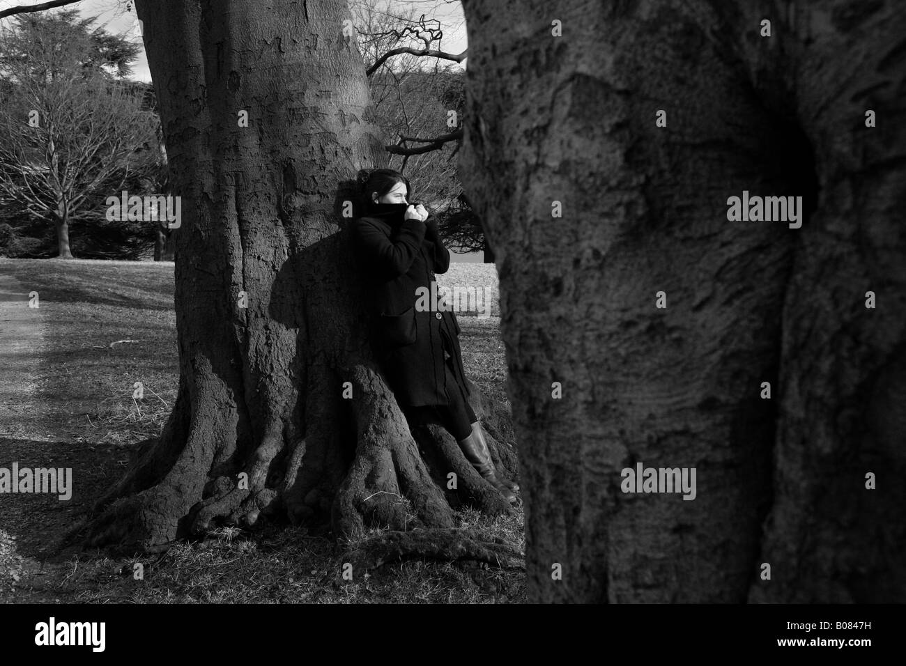 a portrait of a beautiful woman in natural surroundings waring winter ...