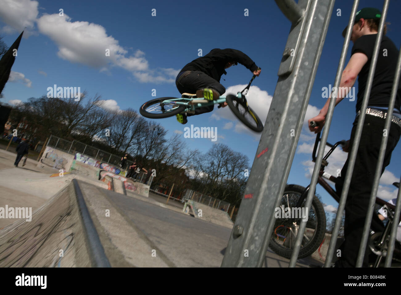 a man rideing a bmx bike at speed on a half pipe Stock Photo - Alamy