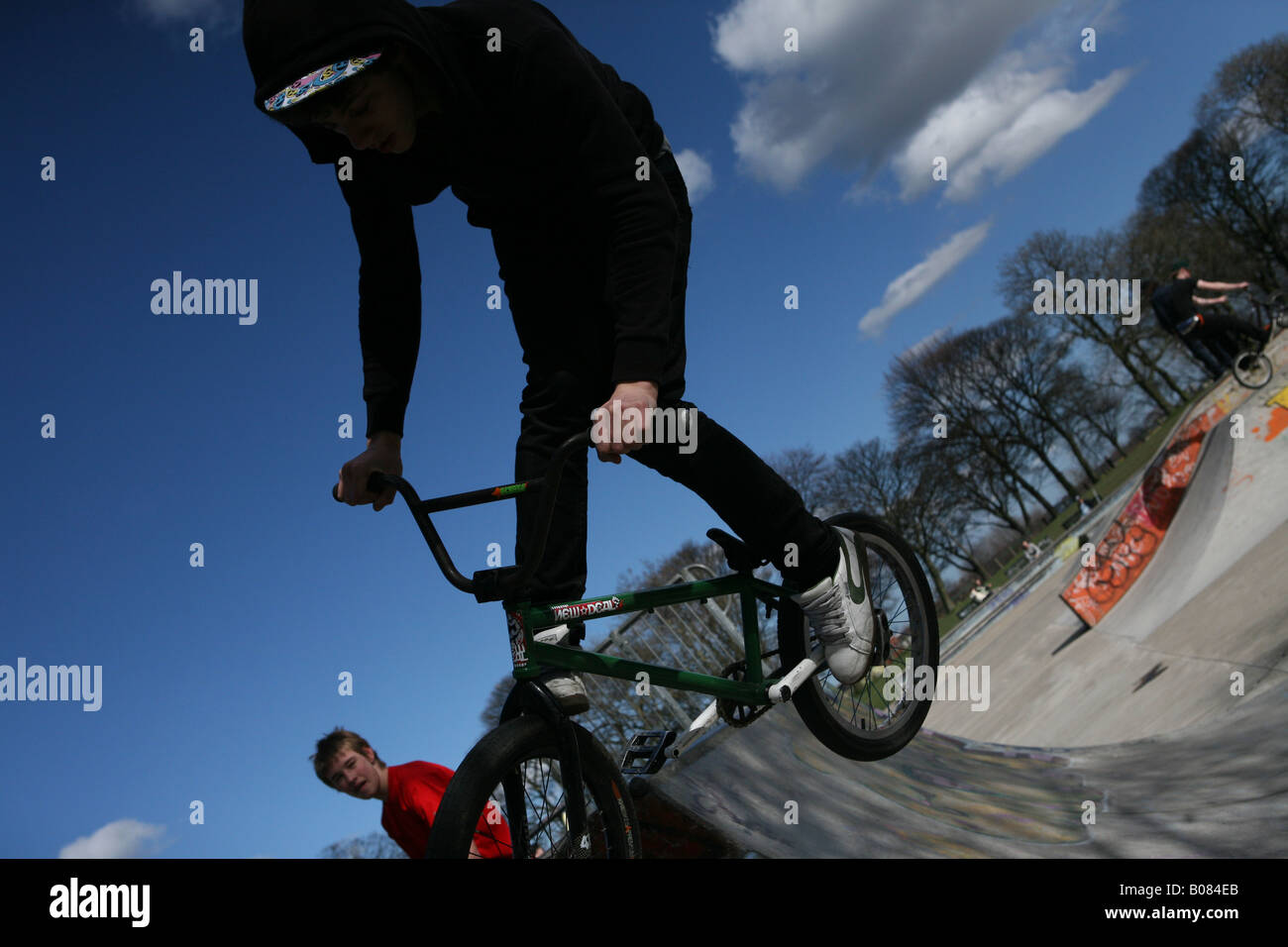 a man doing a trick on a bmx bike on a half pipe Stock Photo - Alamy