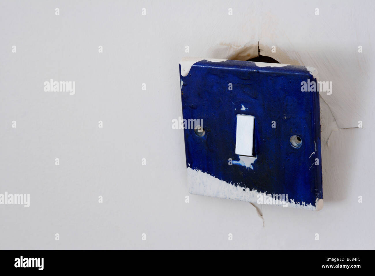 broken blue light switch close up Stock Photo - Alamy