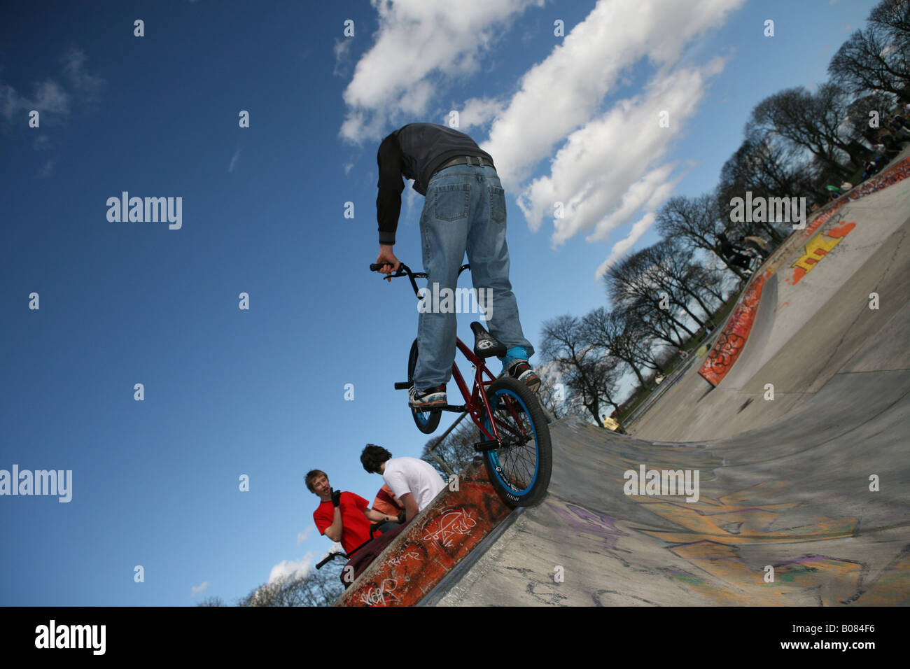 a man riding a bmx bycicle on a half pipe Stock Photo - Alamy