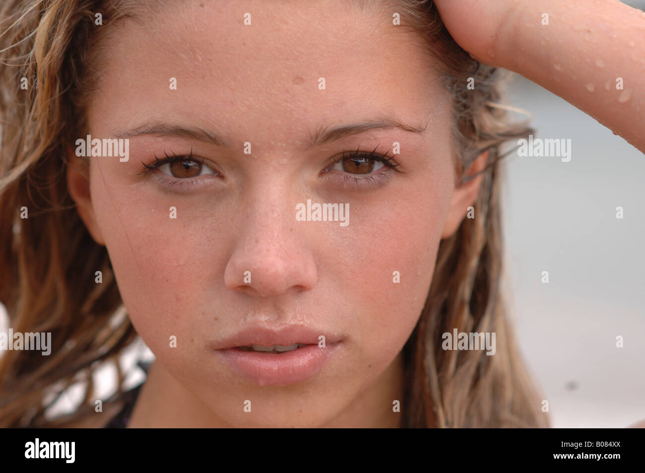 A young woman emerging from the ocean Stock Photo - Alamy
