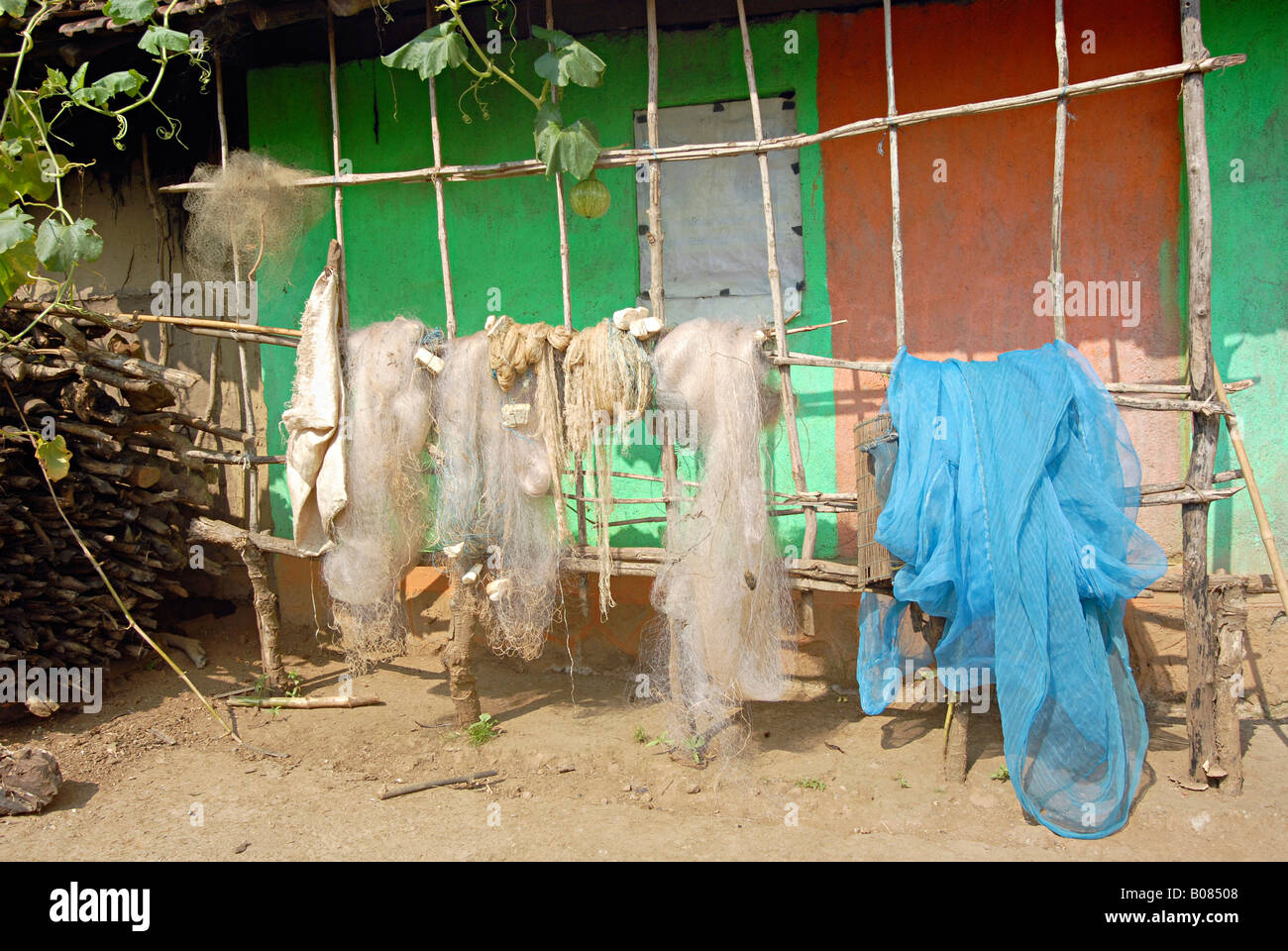 Fishing nets hanged for drying outside the house Stock Photo - Alamy