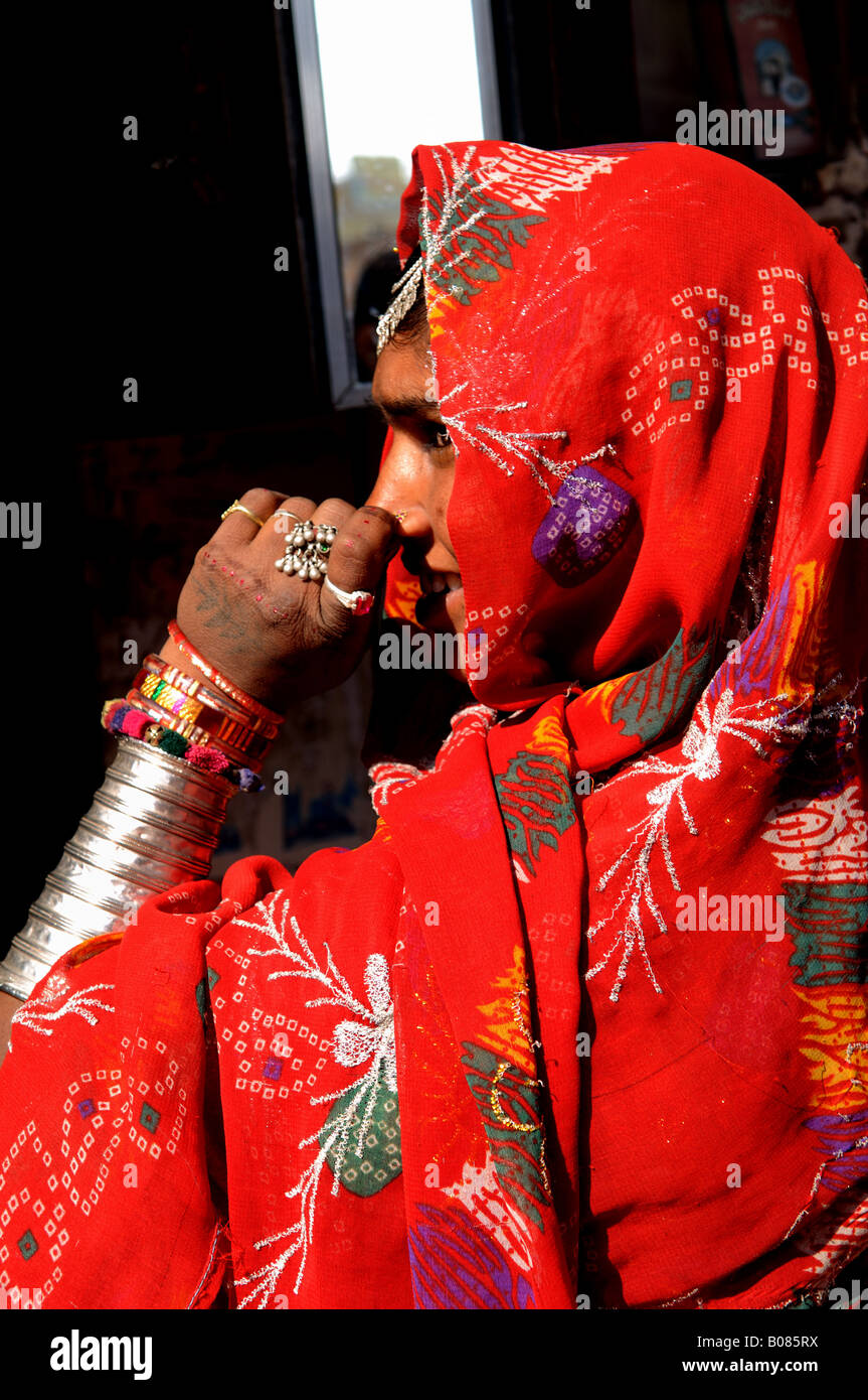 Beautiful Rajasthani woman wearing a traditional red sari Stock Photo ...