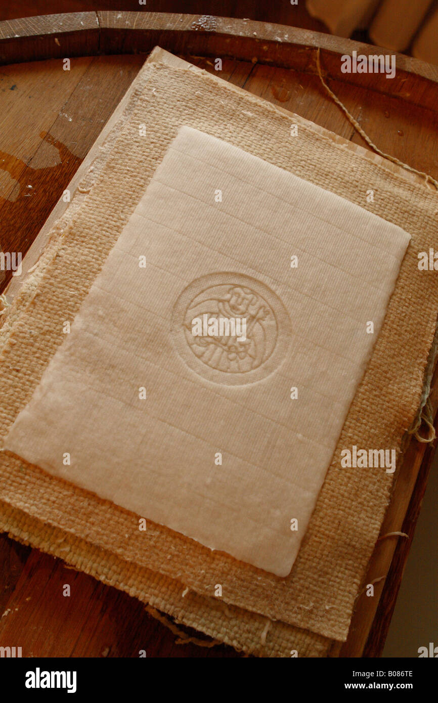 Handmade paper sheet being made with a watermark impression Stock Photo ...