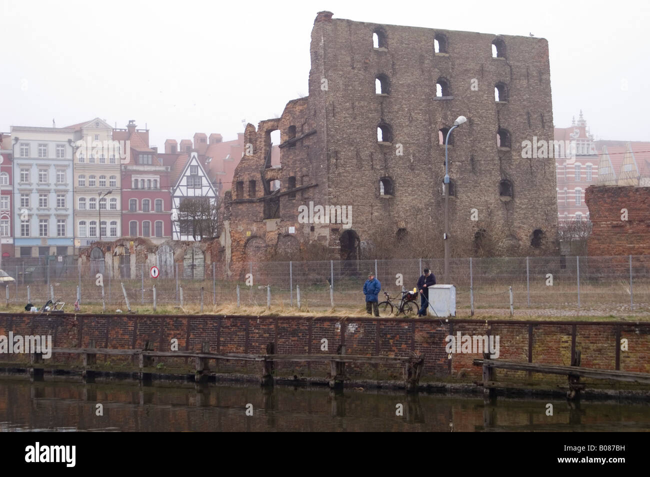 Two men fishing in the Stara (river) Motlawa in Gdansk (Danzig), Poland ...