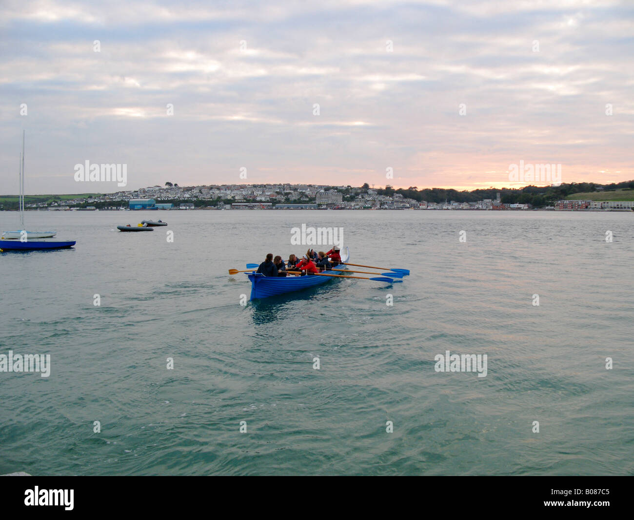 People rowing out on a gig at Rock Cornwall UK Stock Photo - Alamy