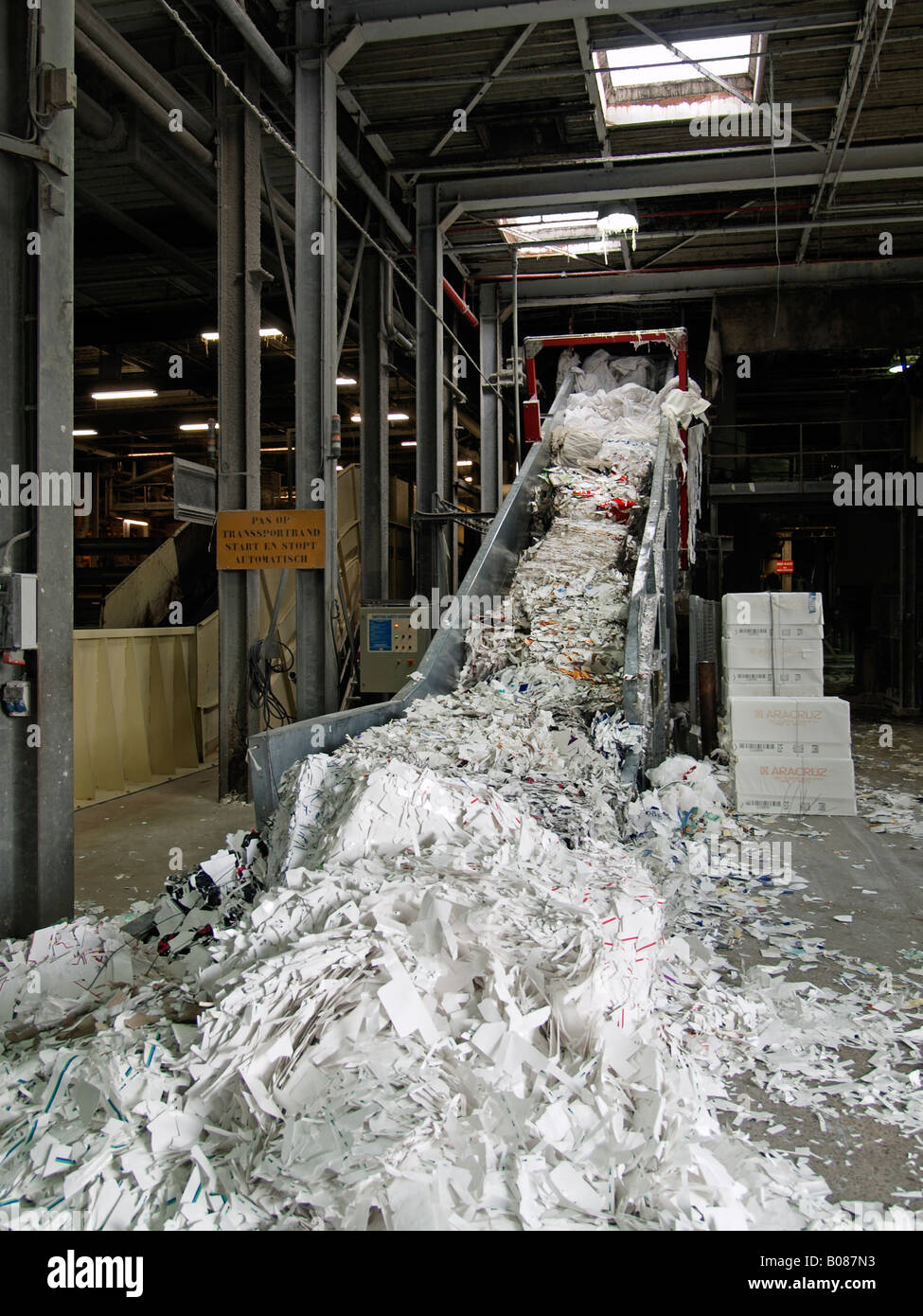 Conveyor belt feeding waste paper hi-res stock photography and images ...