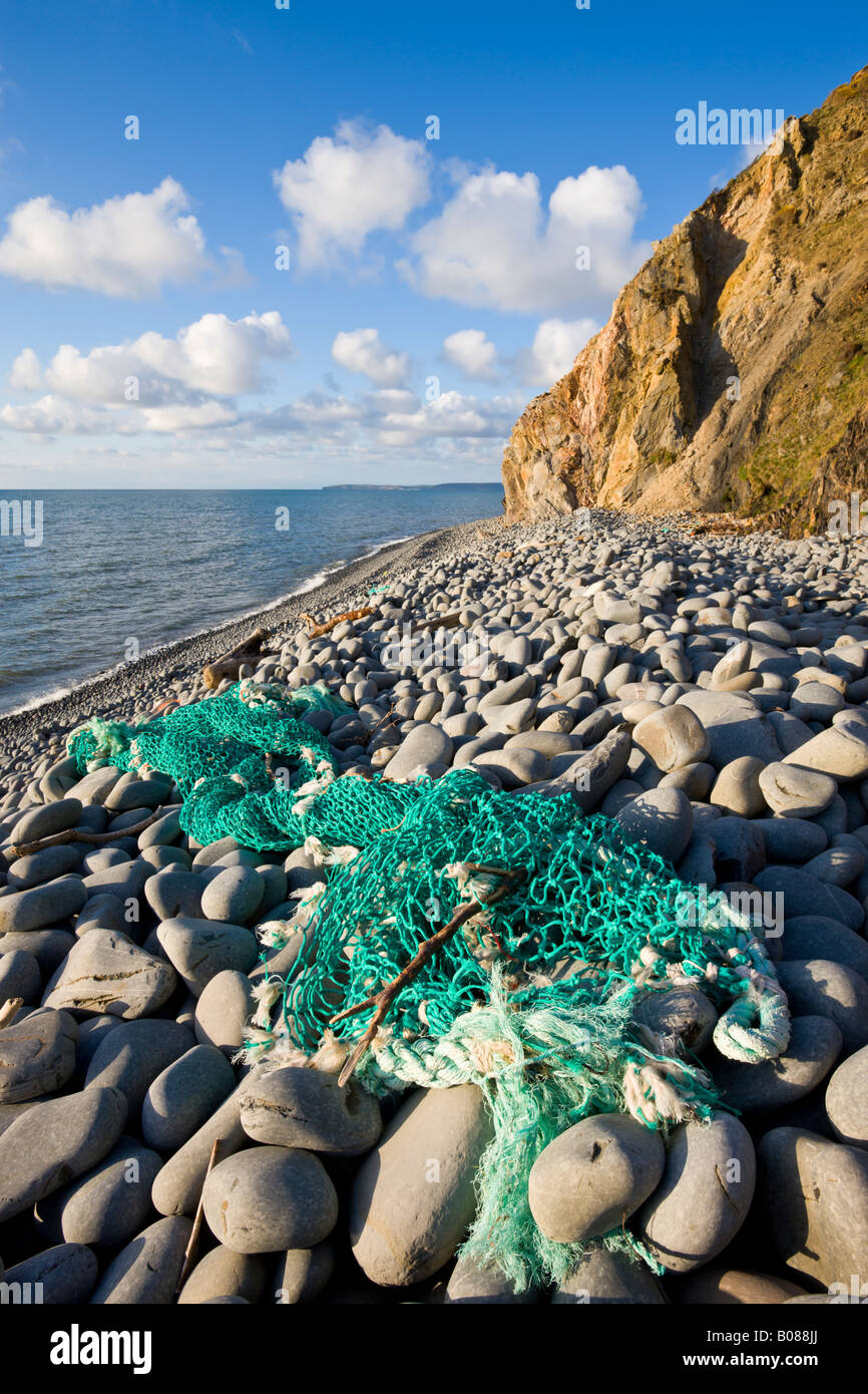 Washed up fishing net on the pebbly beach at Abbotsham in North Devon ...