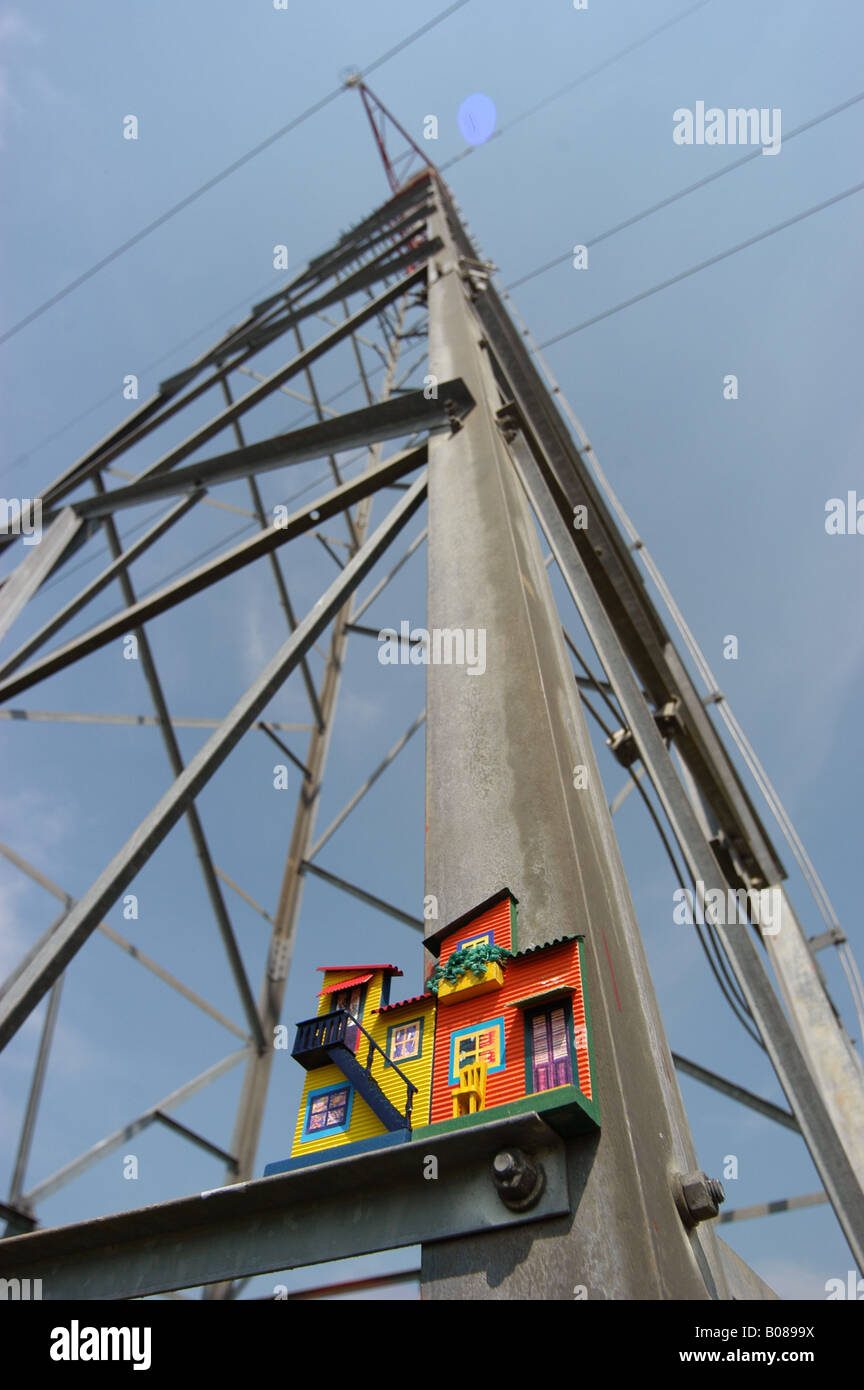 Pylon with houses Stock Photo - Alamy