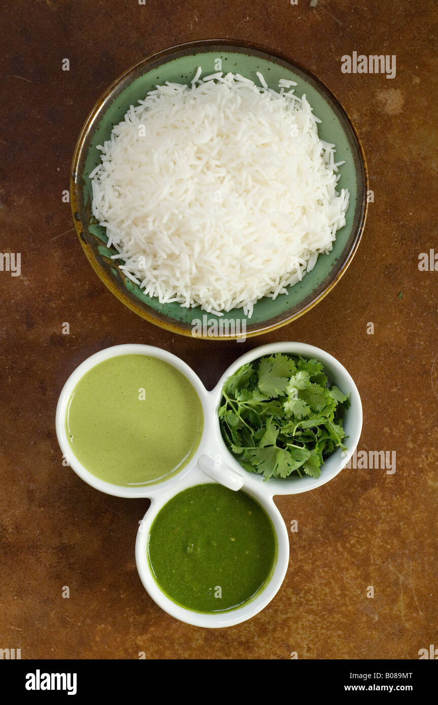 A bowl of rice with herbs and garnishes Stock Photo - Alamy