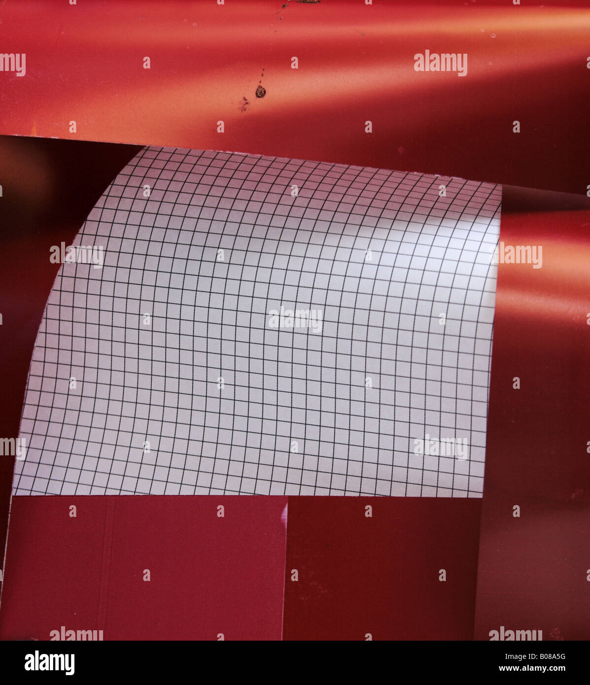curved red printer blotting papers frame a piece of graph paper Stock ...
