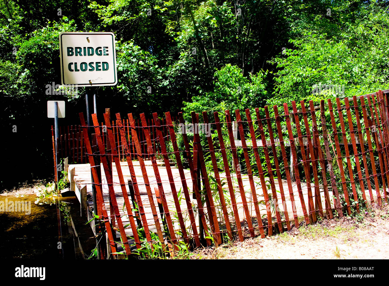 Camping trail with warning sign Stock Photo - Alamy