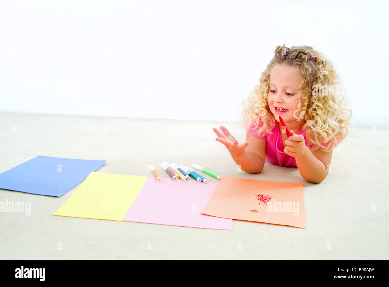 Little girl drawing with markers Stock Photo - Alamy