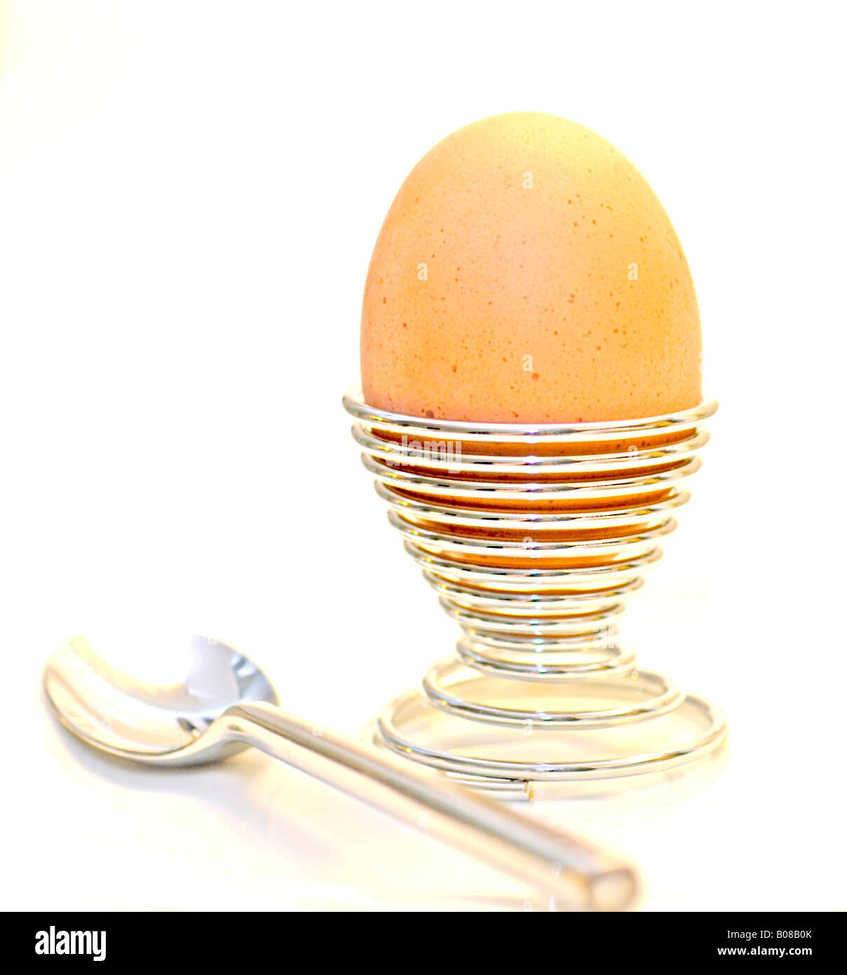 Boiled Egg in Spiral Egg Cup with Spoon Stock Photo - Alamy