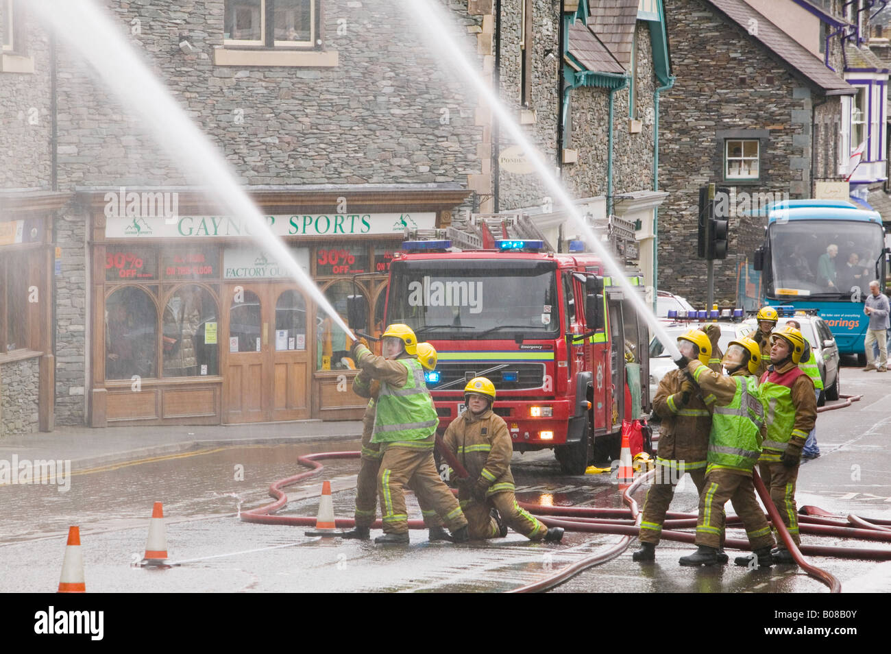 A fire being tackled by firemen in Ambleside Cumbria UK Stock Photo - Alamy