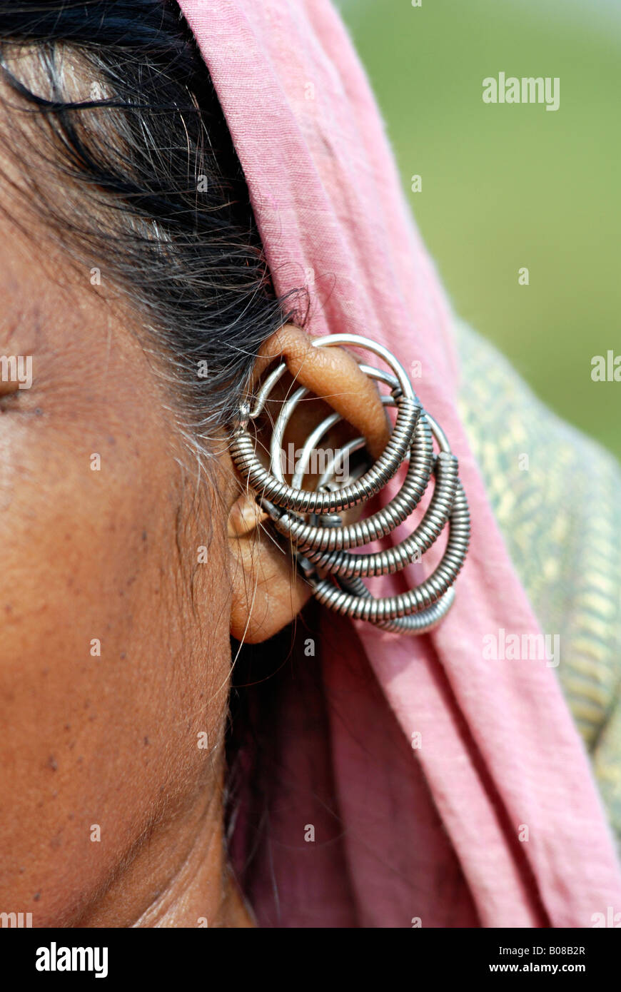Close up of a women wearing traditional Pawra jewelry. Bhil tribe Stock ...