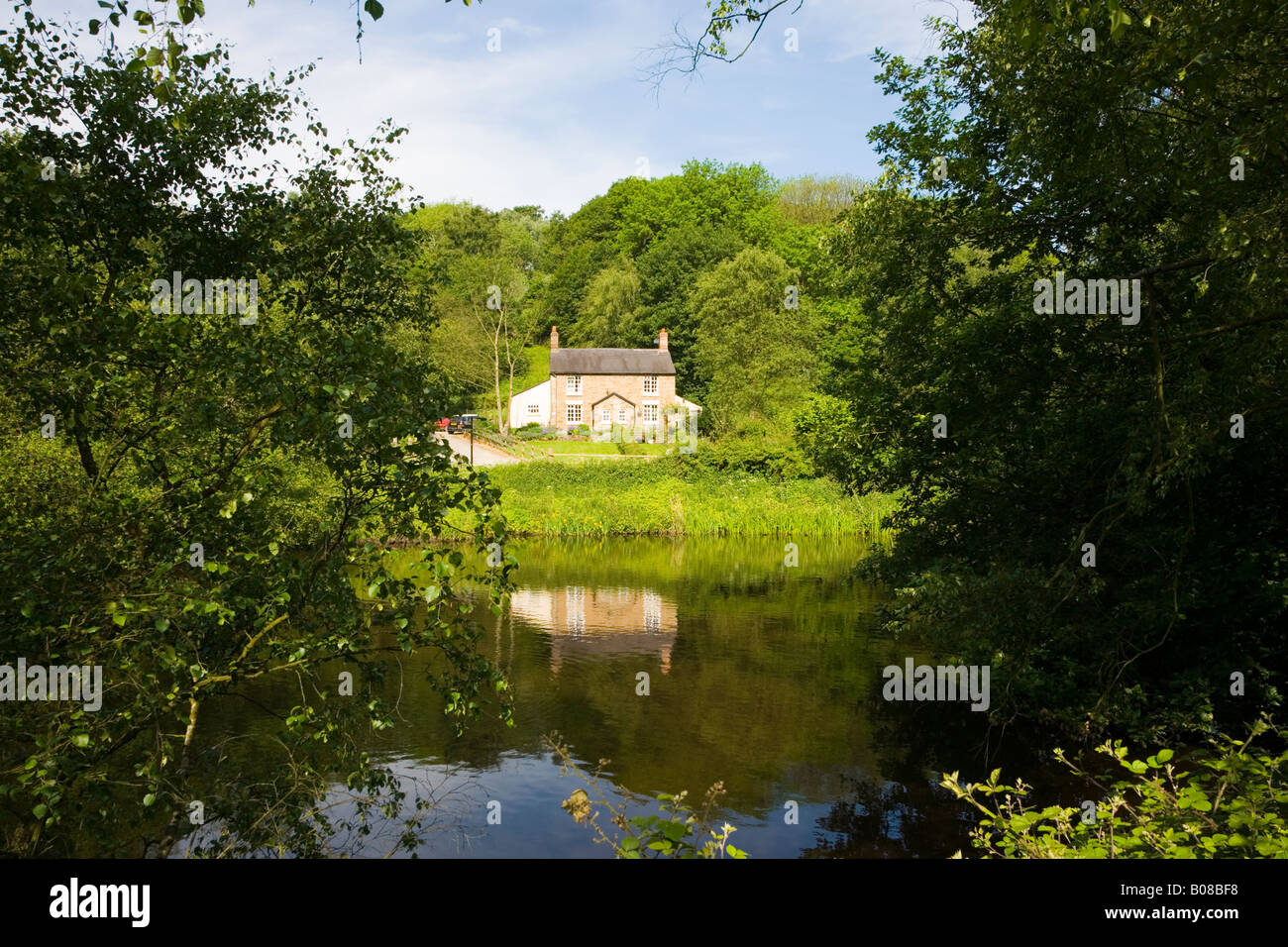 Reflection of Cottages in Lake at Etherow Country Park at Compstall ...