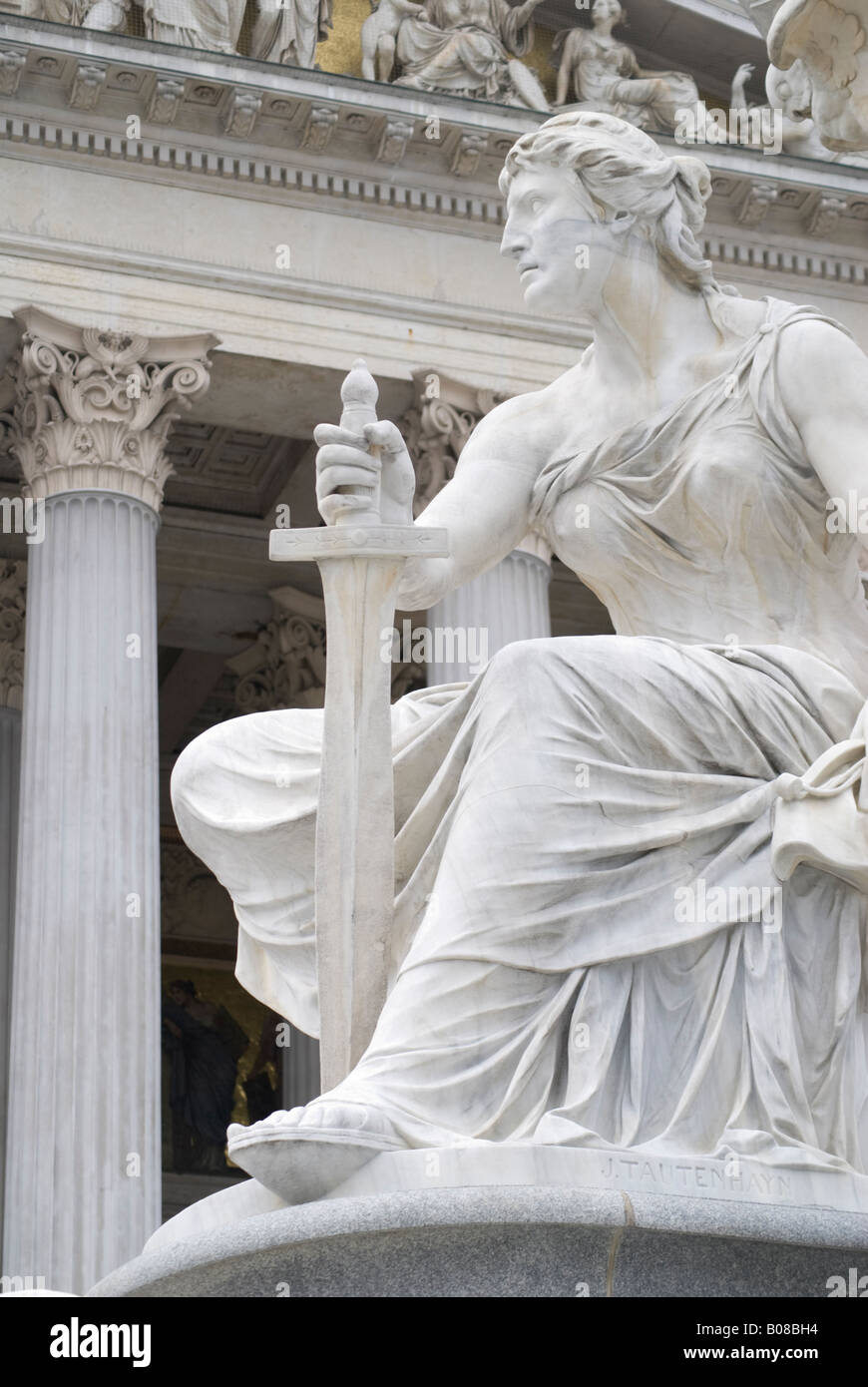 Vienna, Austria. Statue holding sword, in front of the Parliament ...
