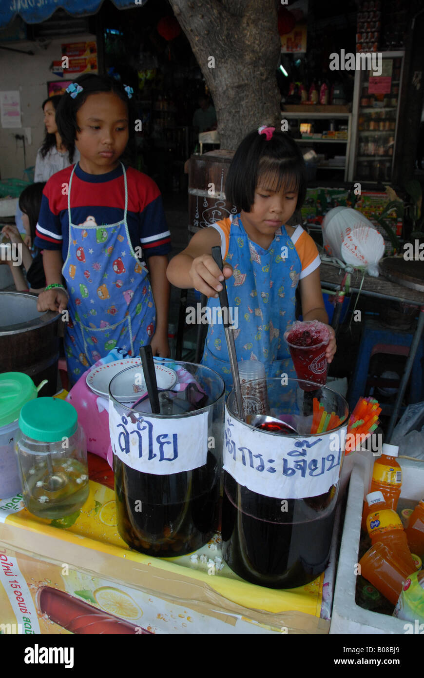 two little girls selling cold drink at chatuchak weekend market ...