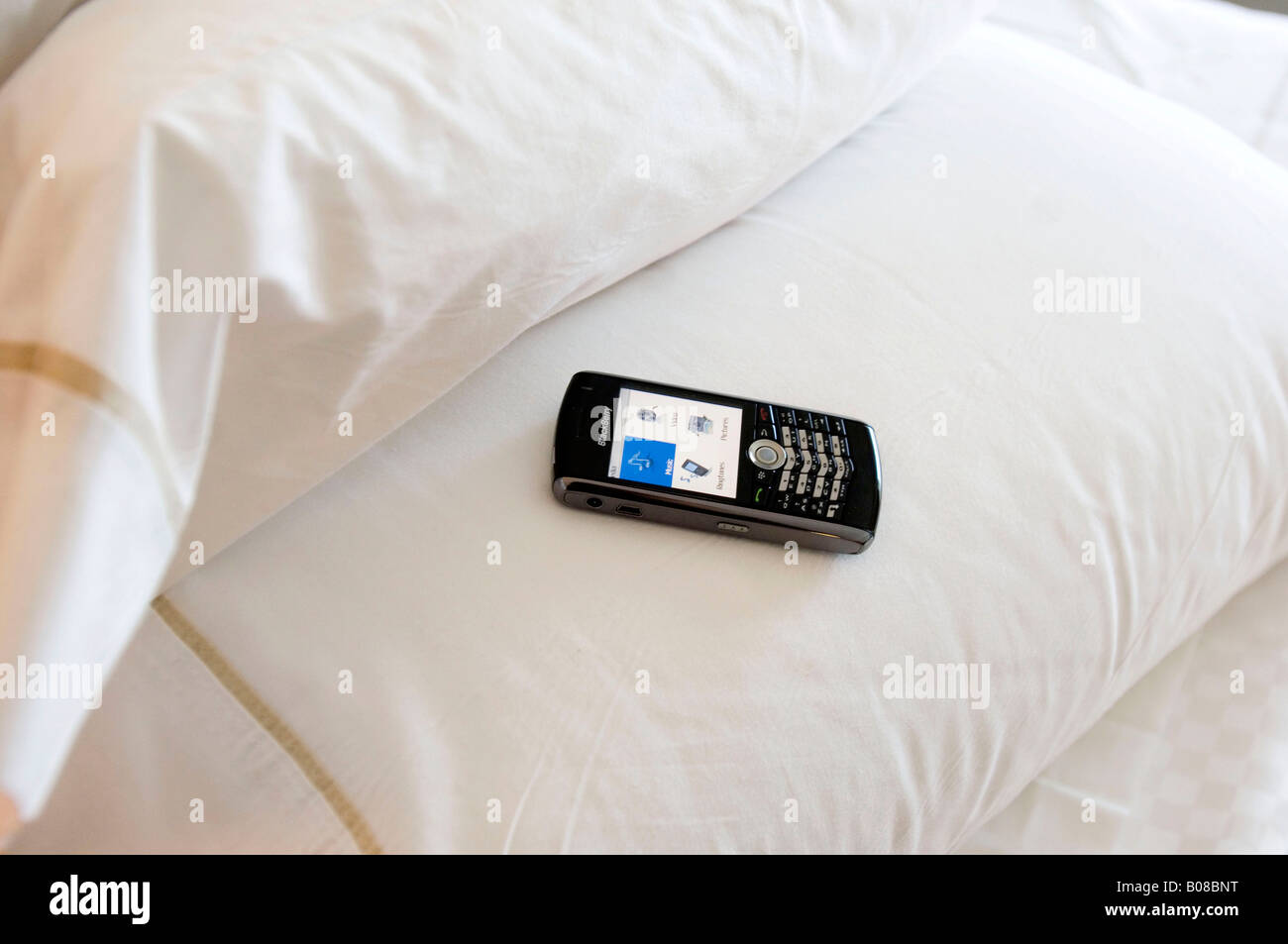 PDA on top of pillow Stock Photo - Alamy