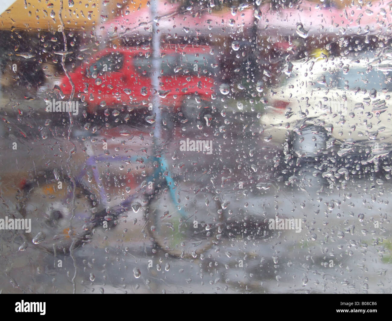 bike and cars with rain drops on window Stock Photo - Alamy
