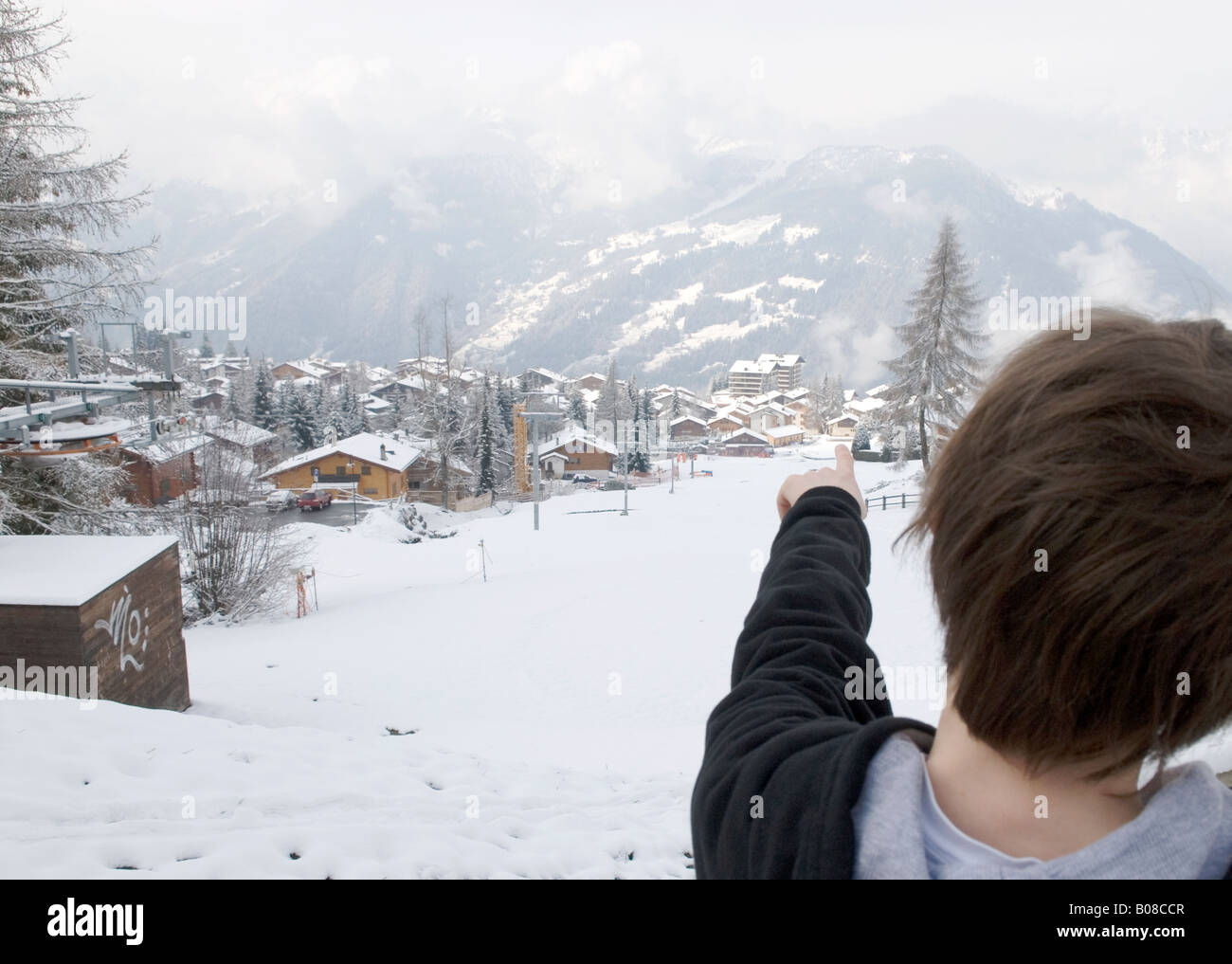 boy pointing at Verbier village Stock Photo - Alamy