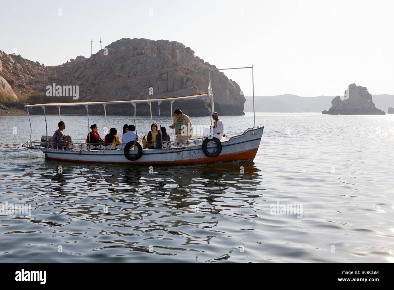 Toursists on motor boat head to the Temple of Philae, Island of Isis ...