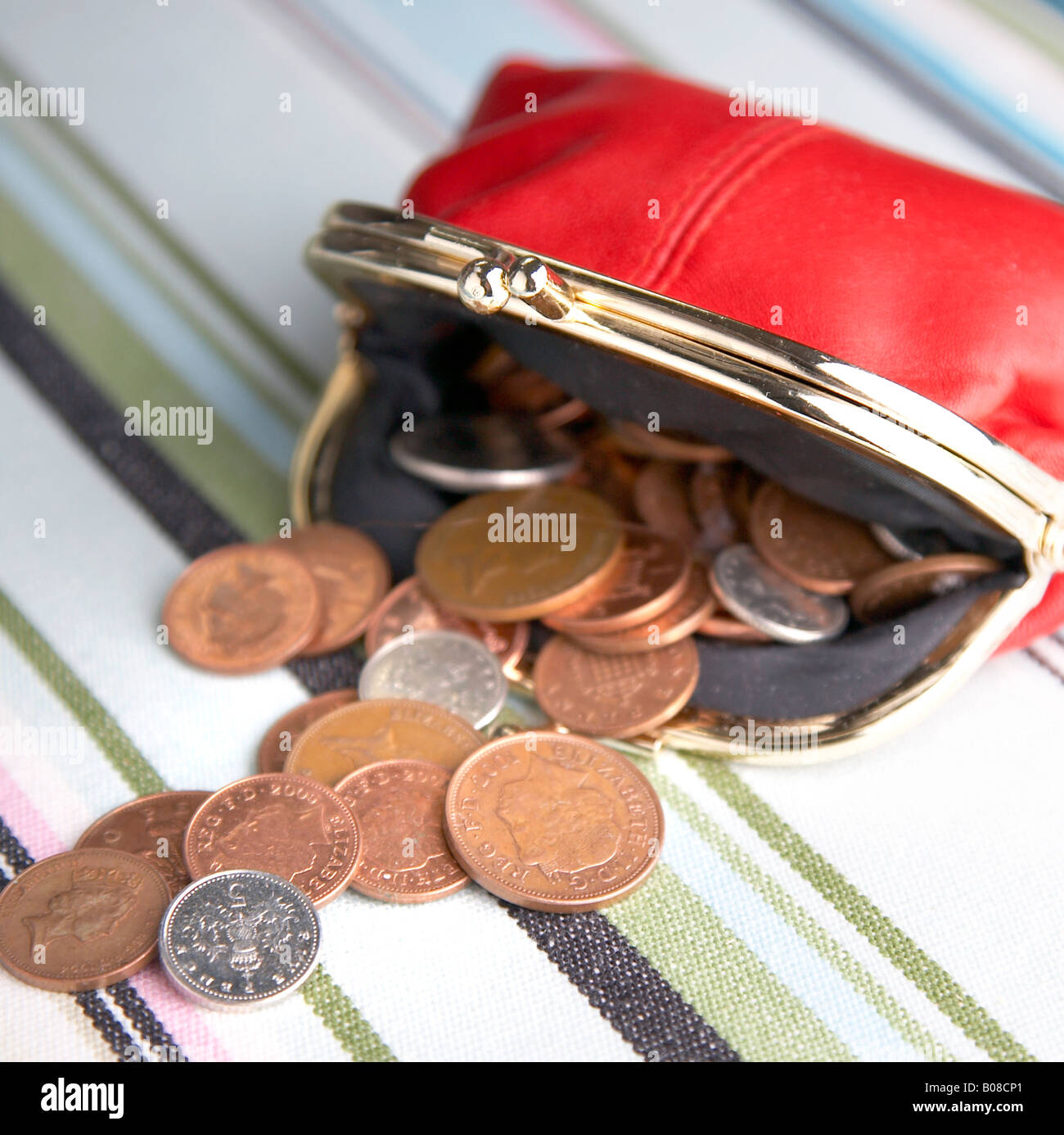Pinching coins hi-res stock photography and images - Alamy