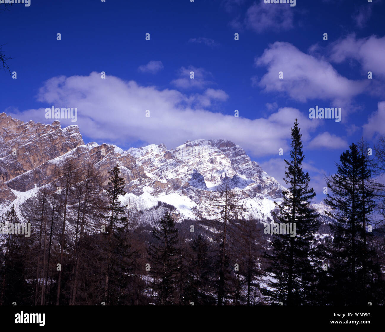 Massive limestone cliffs rising above Cortina D'ampezzo, The Dolomites ...