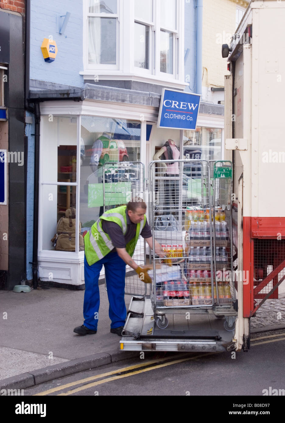 Man Delivering Goods To Shop From back of a Lorry Stock Photo - Alamy