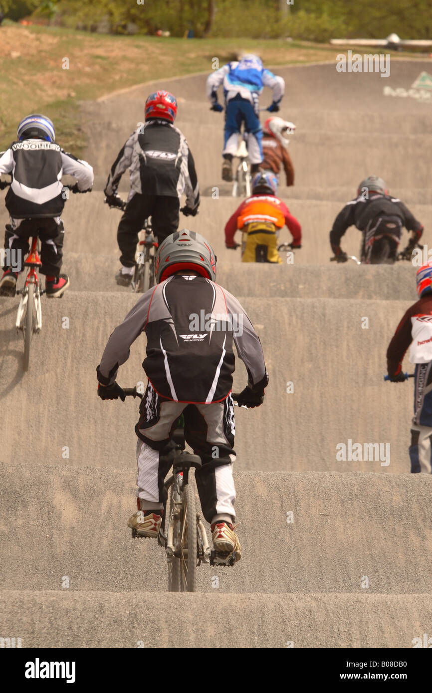 Young BMX bike rider children in national level sport competition jump ...