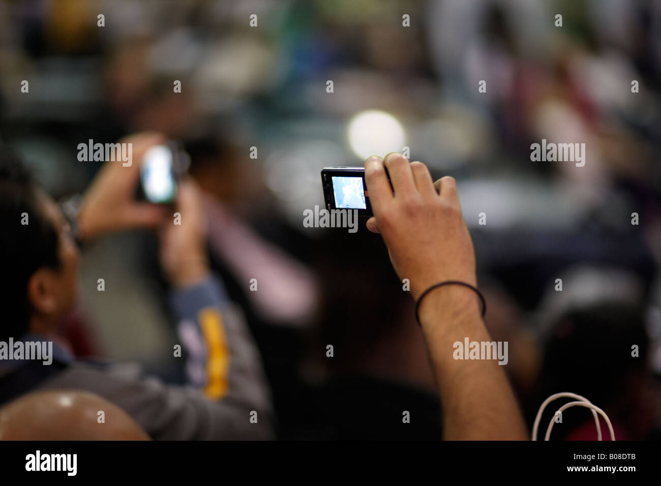 Mobile phone cameras being used to photograph an event Stock Photo - Alamy
