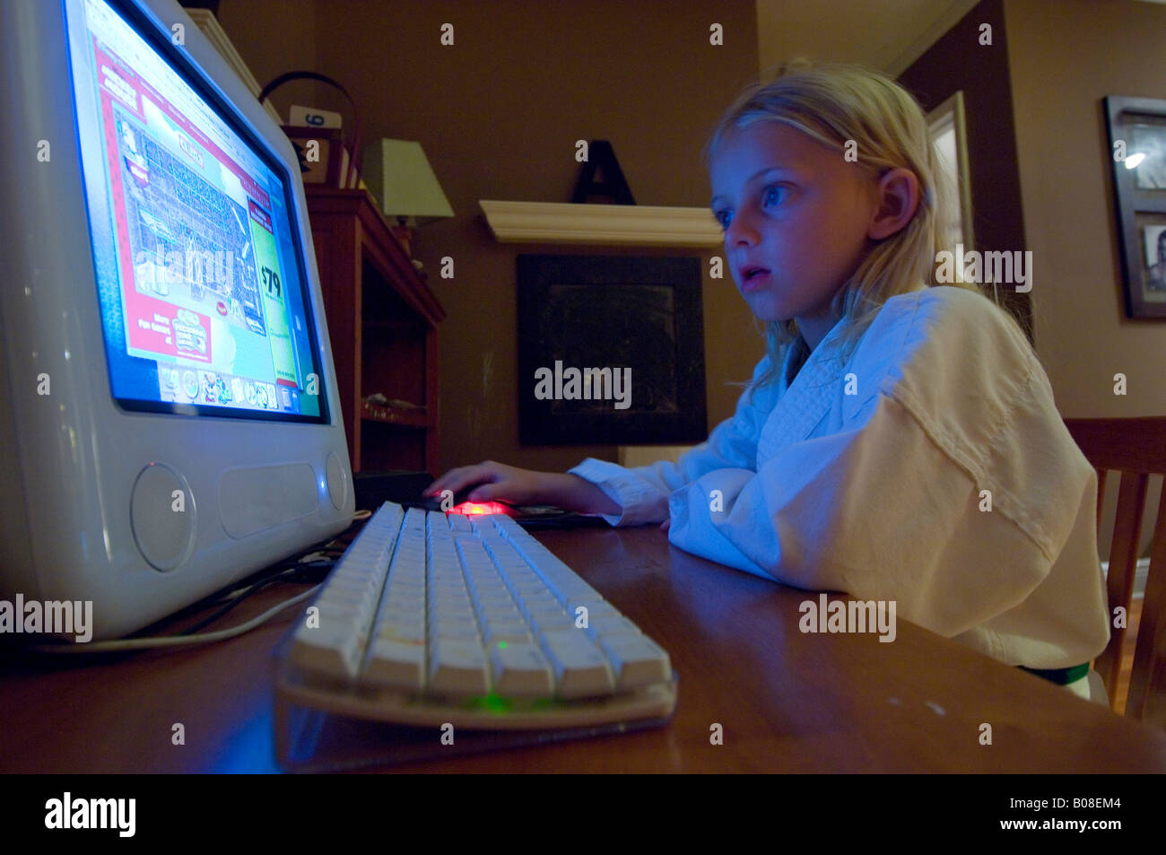 Little girl playing computer games Stock Photo - Alamy
