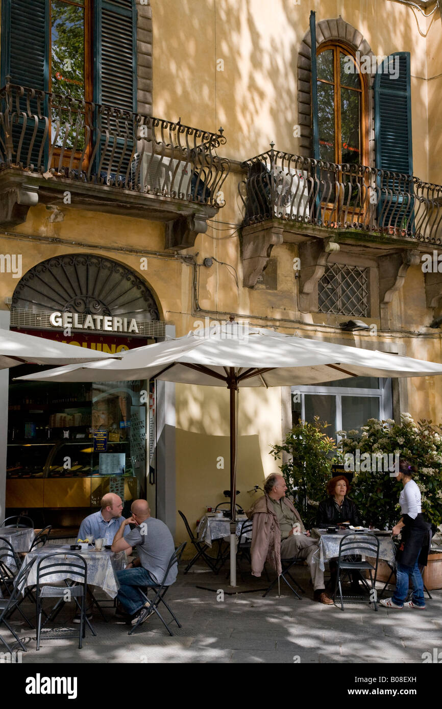 local people in Lucca Tuscany Italy relaxing at lunchtime at a ...