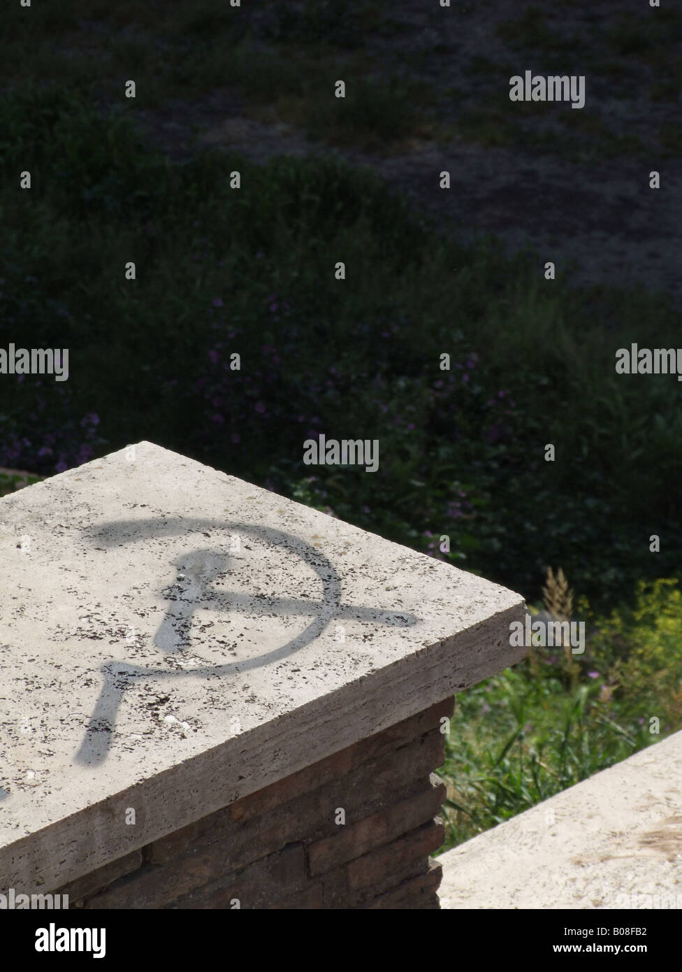communist symbol written on park bench Stock Photo - Alamy