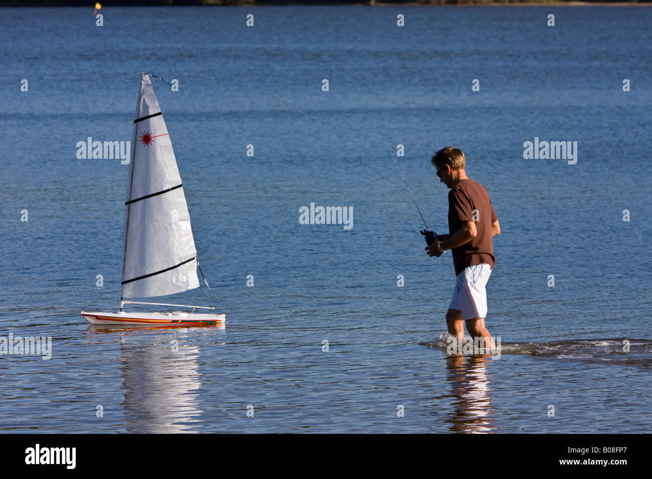 A modeller sailing his radio controlled model sailing boat Stock Photo ...