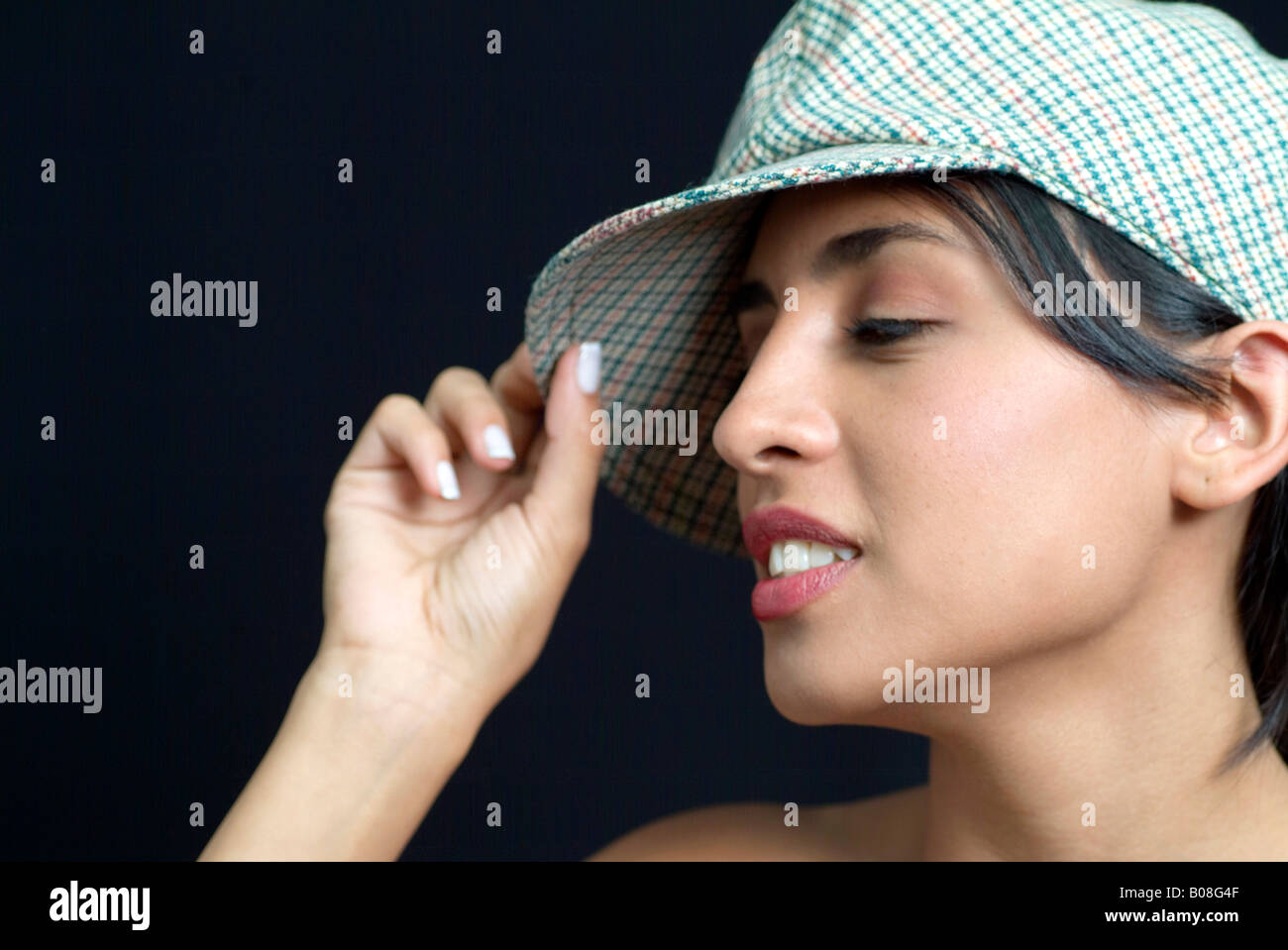 Profile of woman wearing cap Stock Photo - Alamy