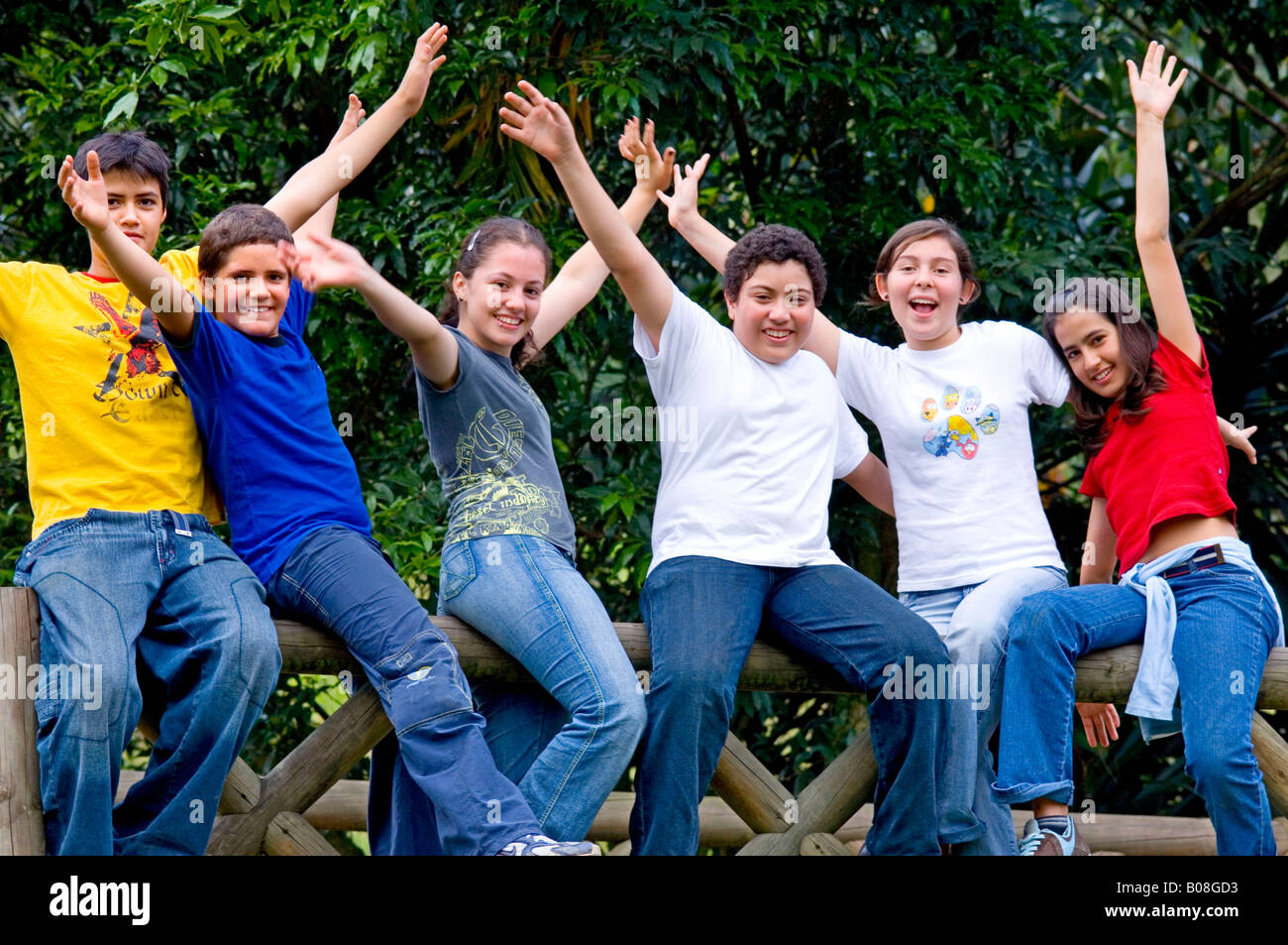Kids waving at camera Stock Photo - Alamy